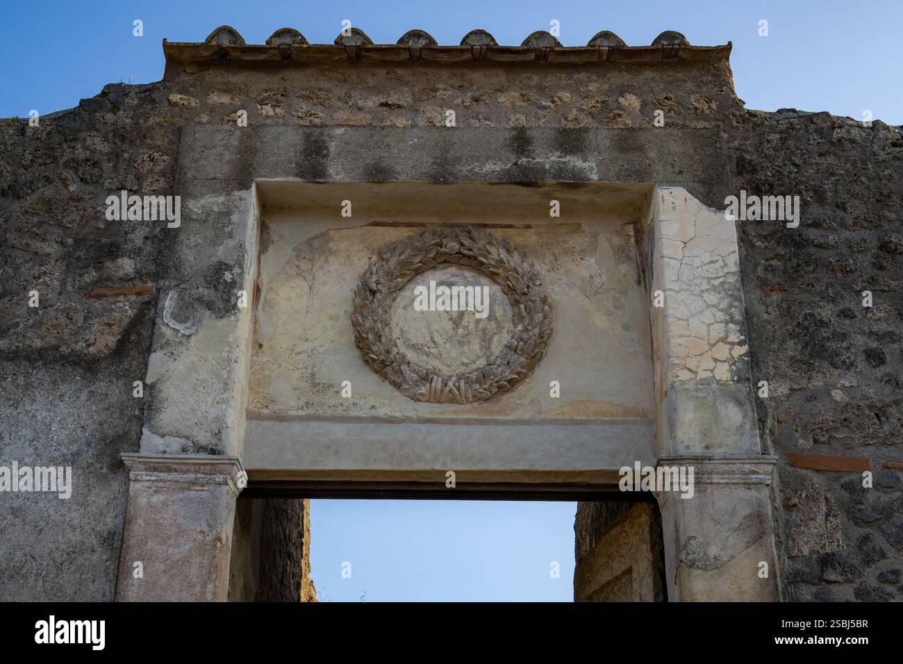 Carved wreath over the doorway of the House of Augustalis, Building II ...