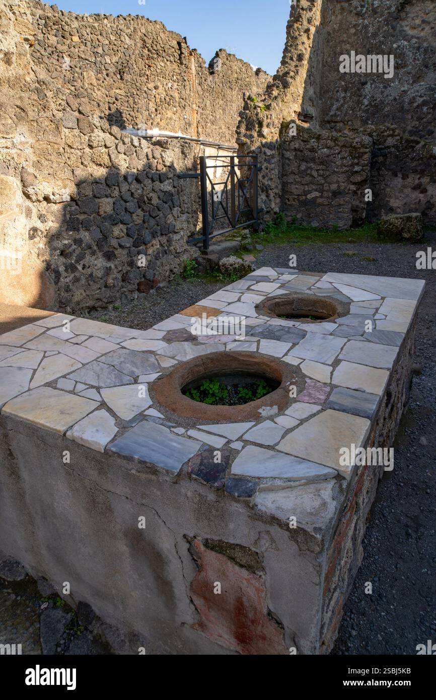 Serving counter of a thermopolium, Building I.7.8, in the ancient Roman ...