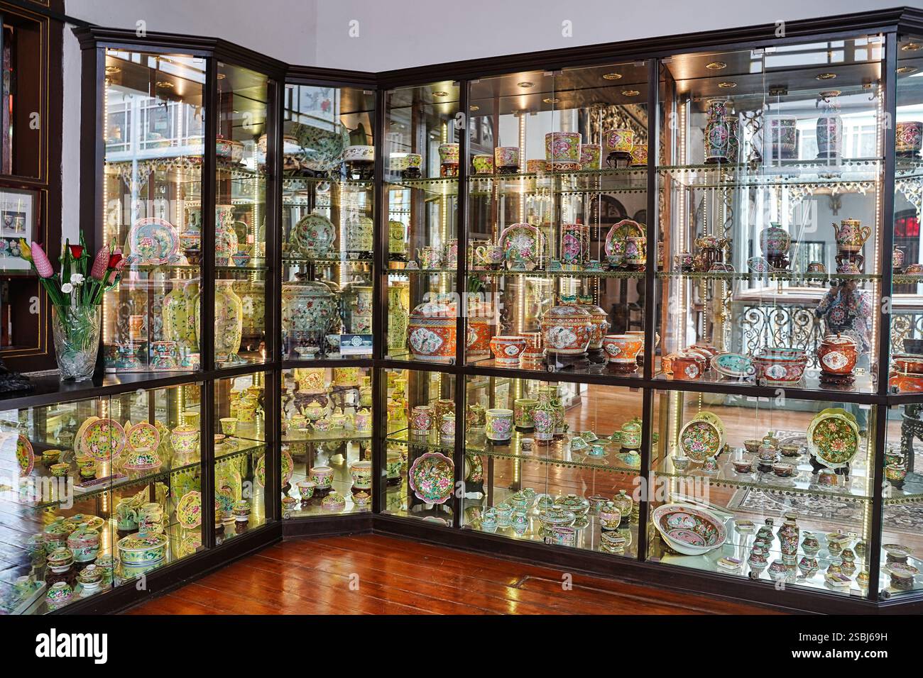 Display cabinets with glass epergnes,porcelain ware and european dinner ...