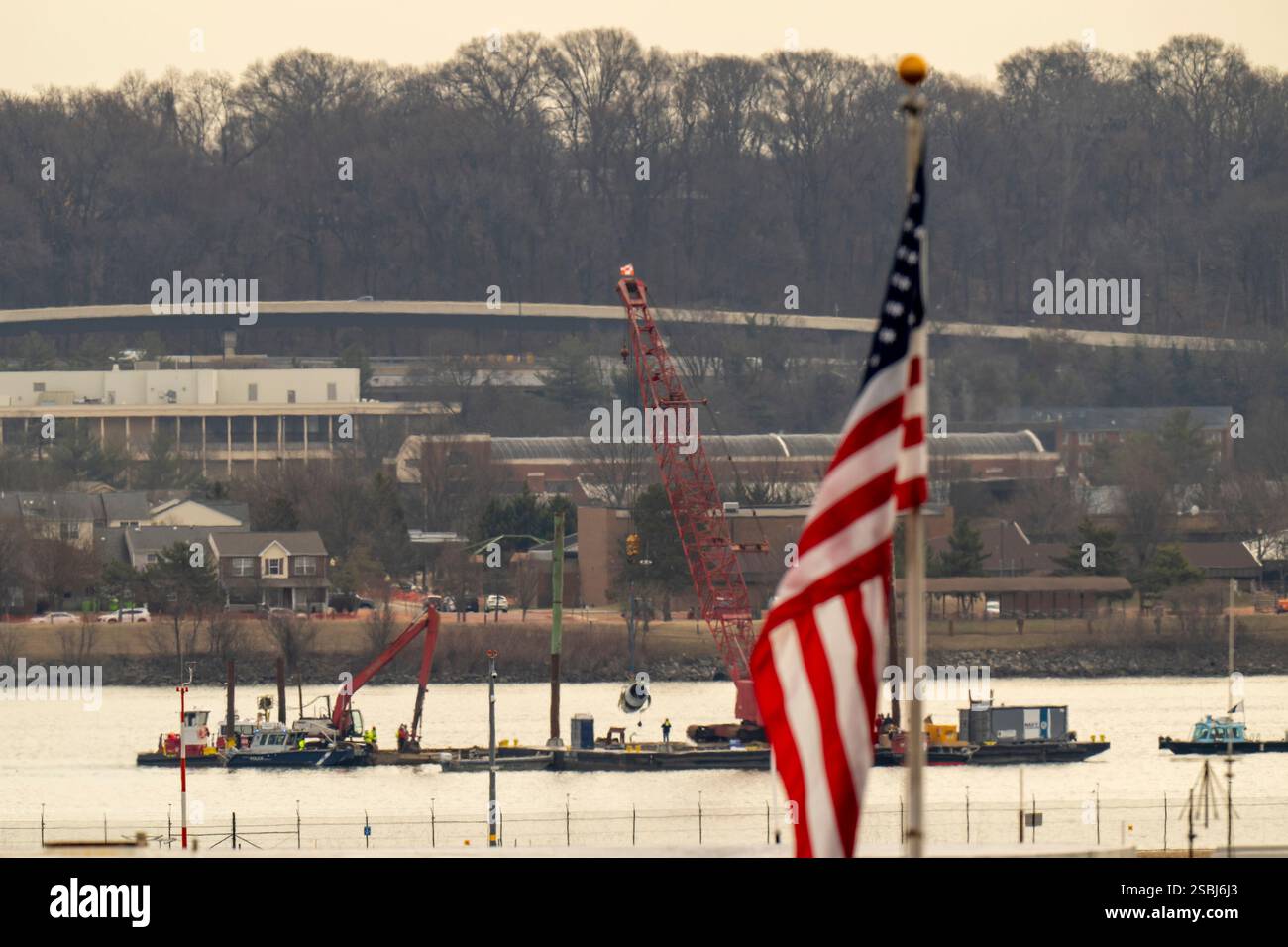 Recovery salvage experts lift the engine of the American Eagle wreckage ...