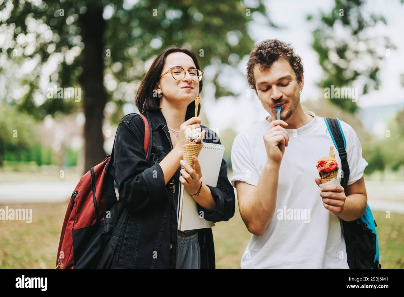 Multicultural students enjoying ice cream in the park during break Stock Photo - Alamy