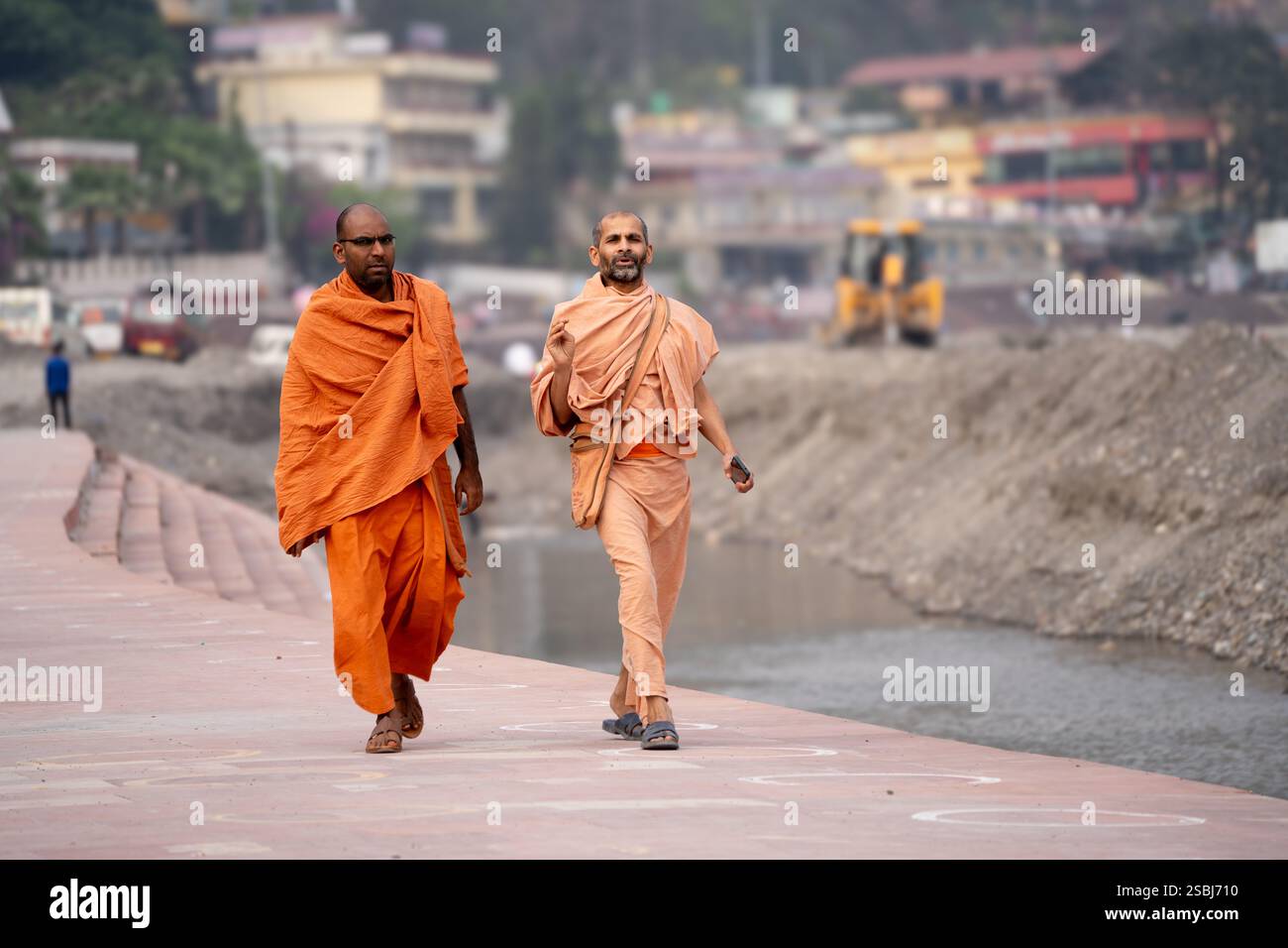 Group of hindu religious sadhu priest holy men walking with bags to the ...