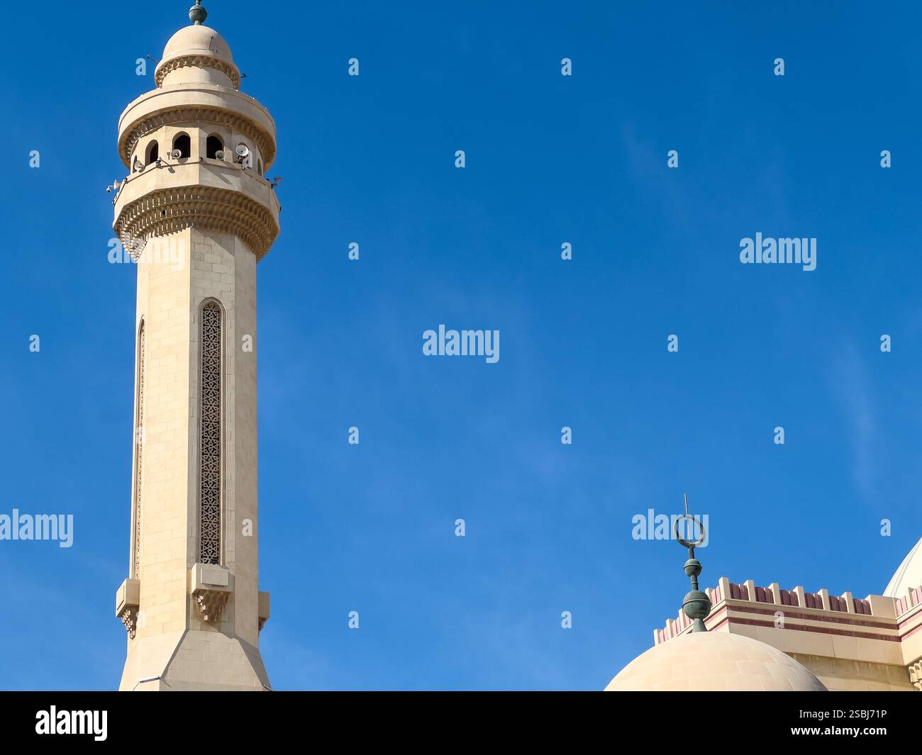 Manama, Bahrain - January 5, 2025: The towering minaret and dome of the ...