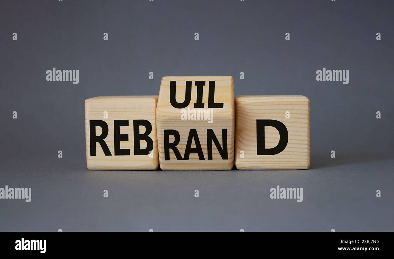 Rebuild and Rebrand symbol. Turned wooden cubes with words Rebrand and ...