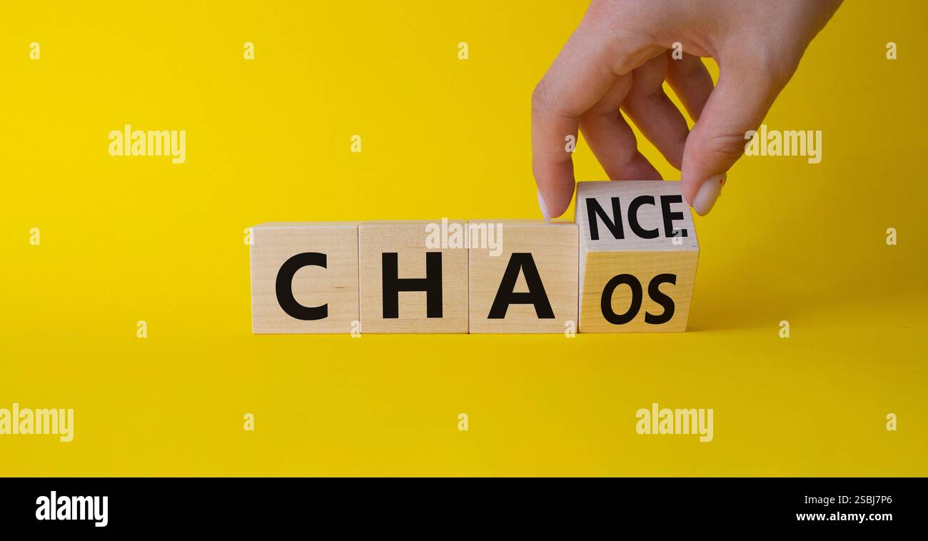 Chance vs Chaos symbol. Businessman hand Turnes cube and changes word Chaos to Chance. Beautiful ...