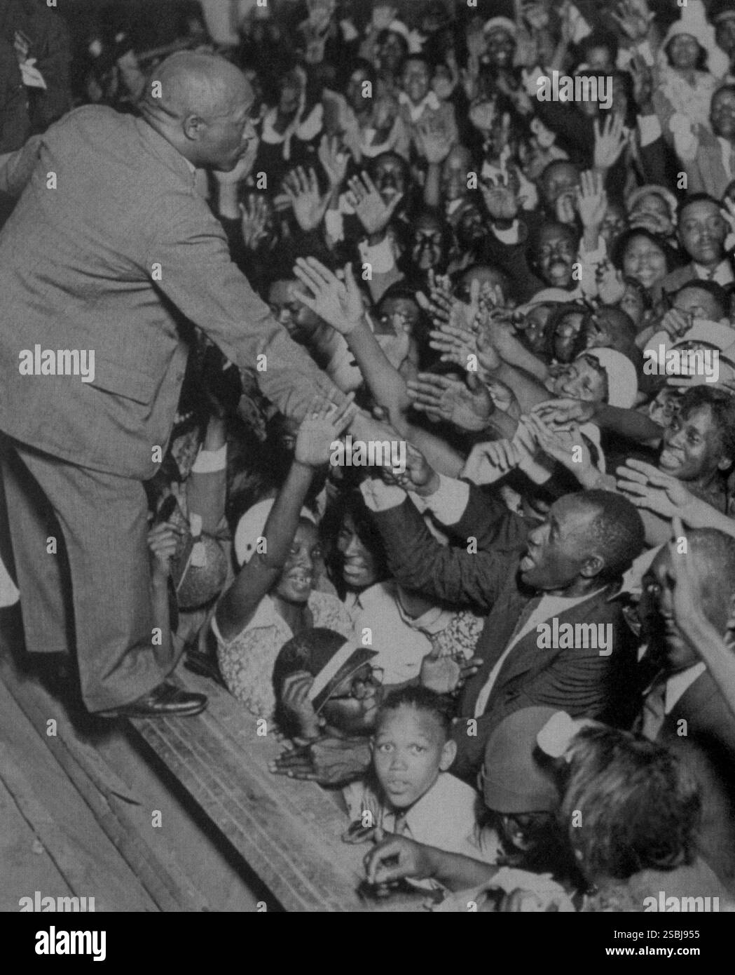 Father Divine (1876-1965) with his followers. He was leader of the ...