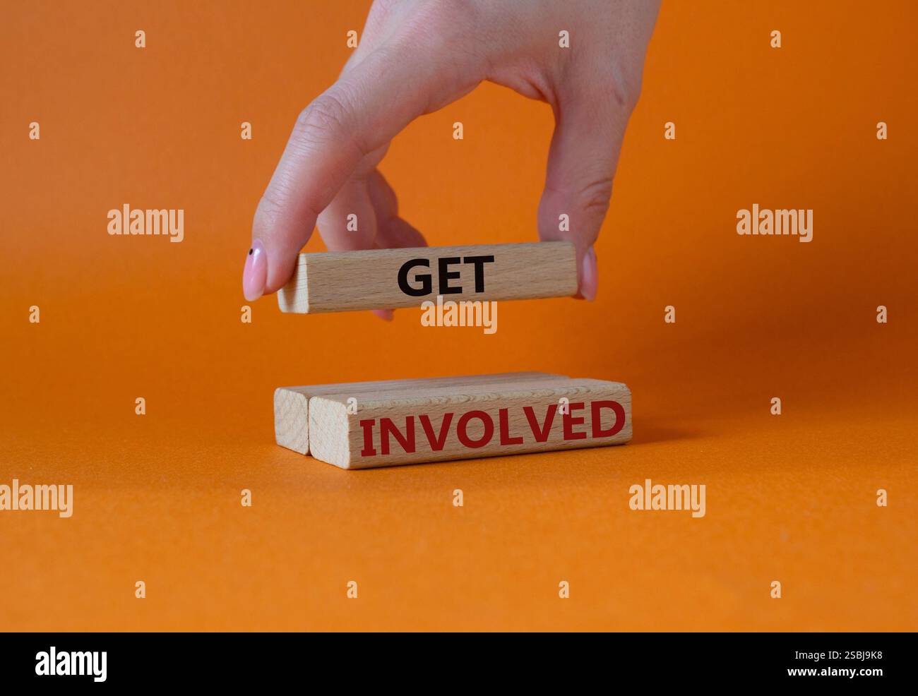 Get involved symbol. Wooden blocks with words Get involved. Businessman ...