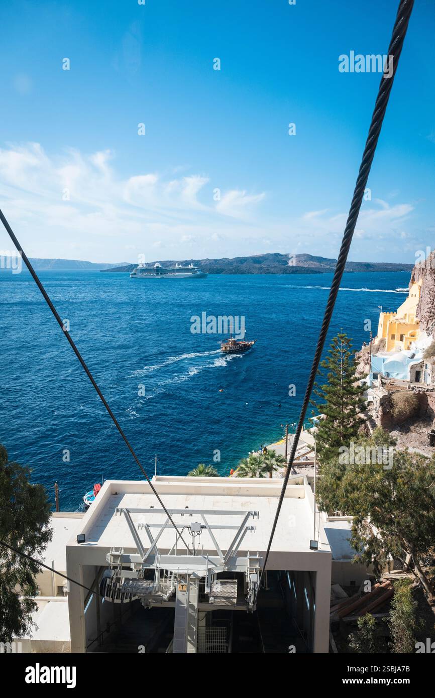 View from the cable car from the harbour up to the town of Fira to a ...