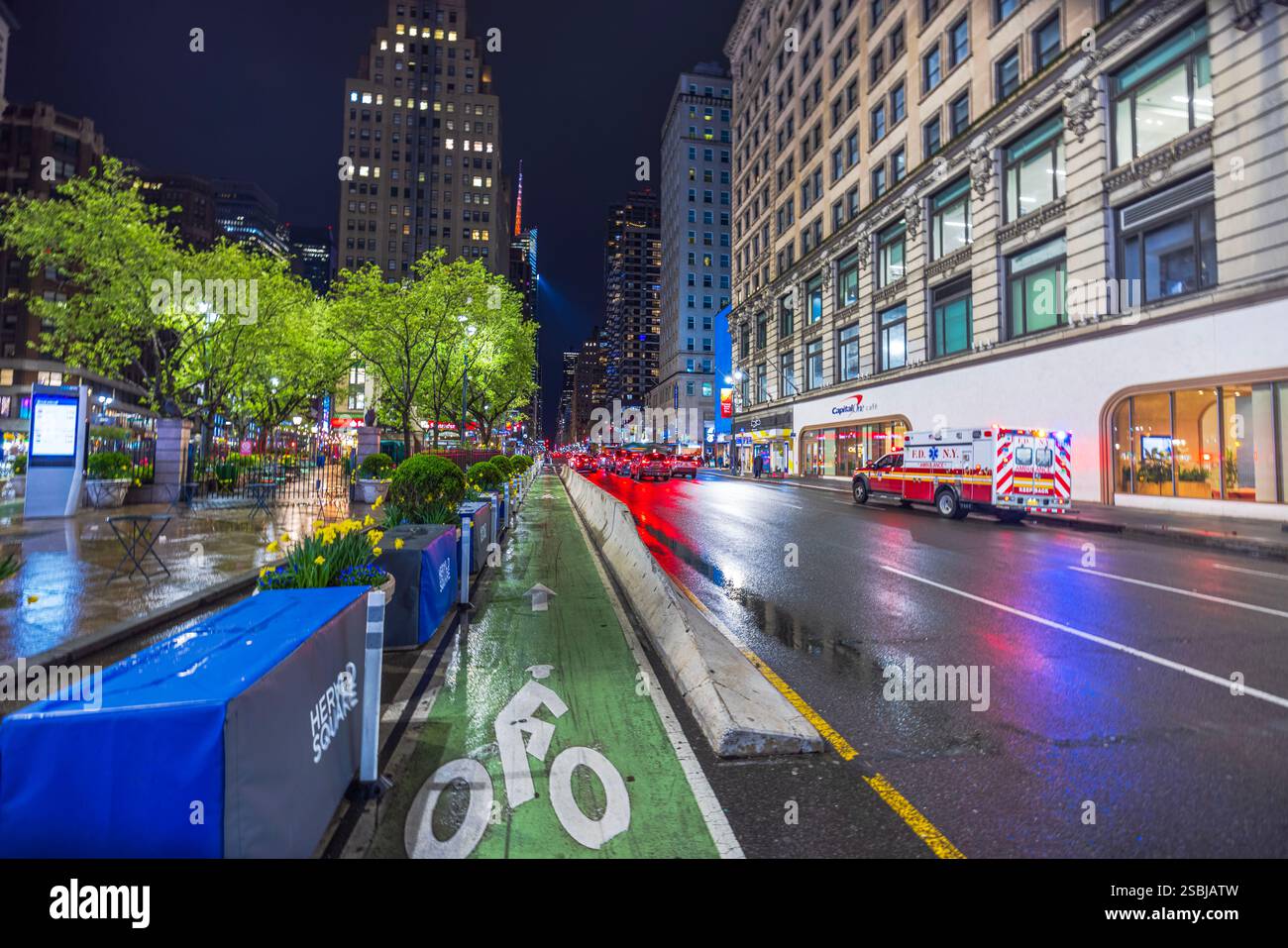 FDNY ambulance parked on rainy Manhattan street at night with ...