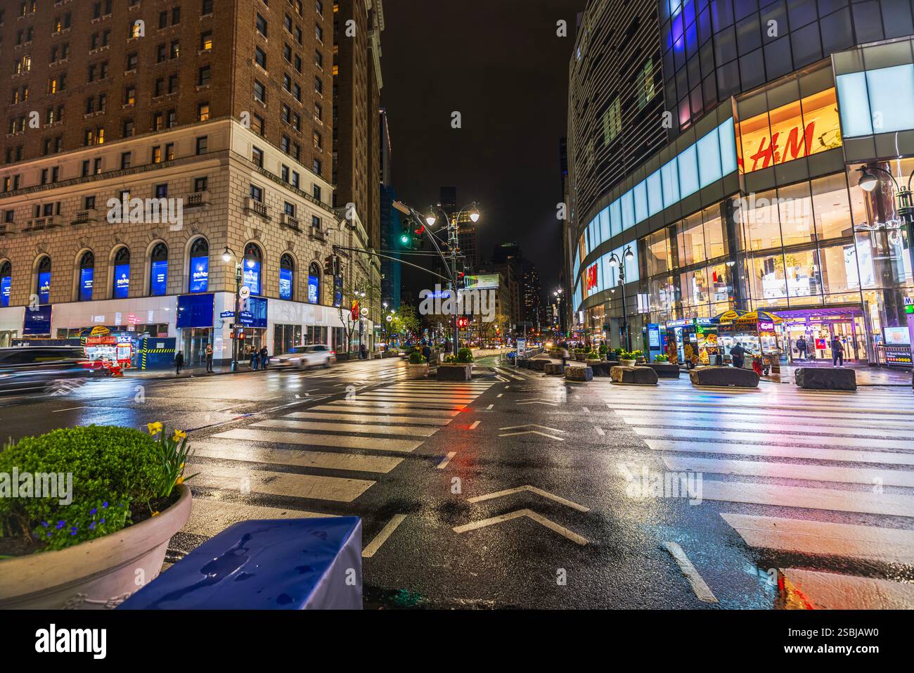 Wet pedestrian crosswalk at night in Manhattan with reflections on ...