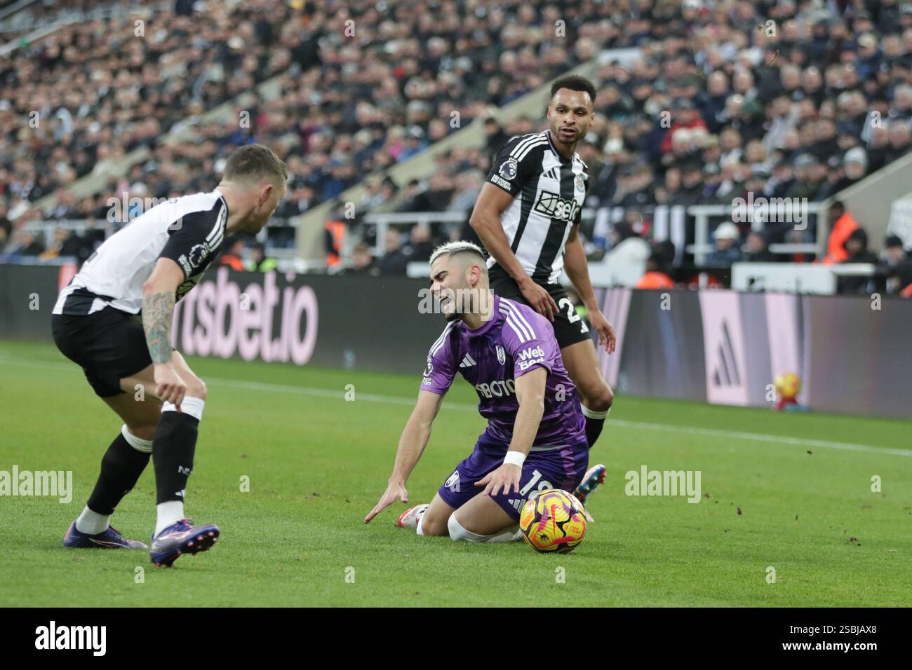 Jacob Murphy of Newcastle United tackles Andreas Pereira of Fulham ...
