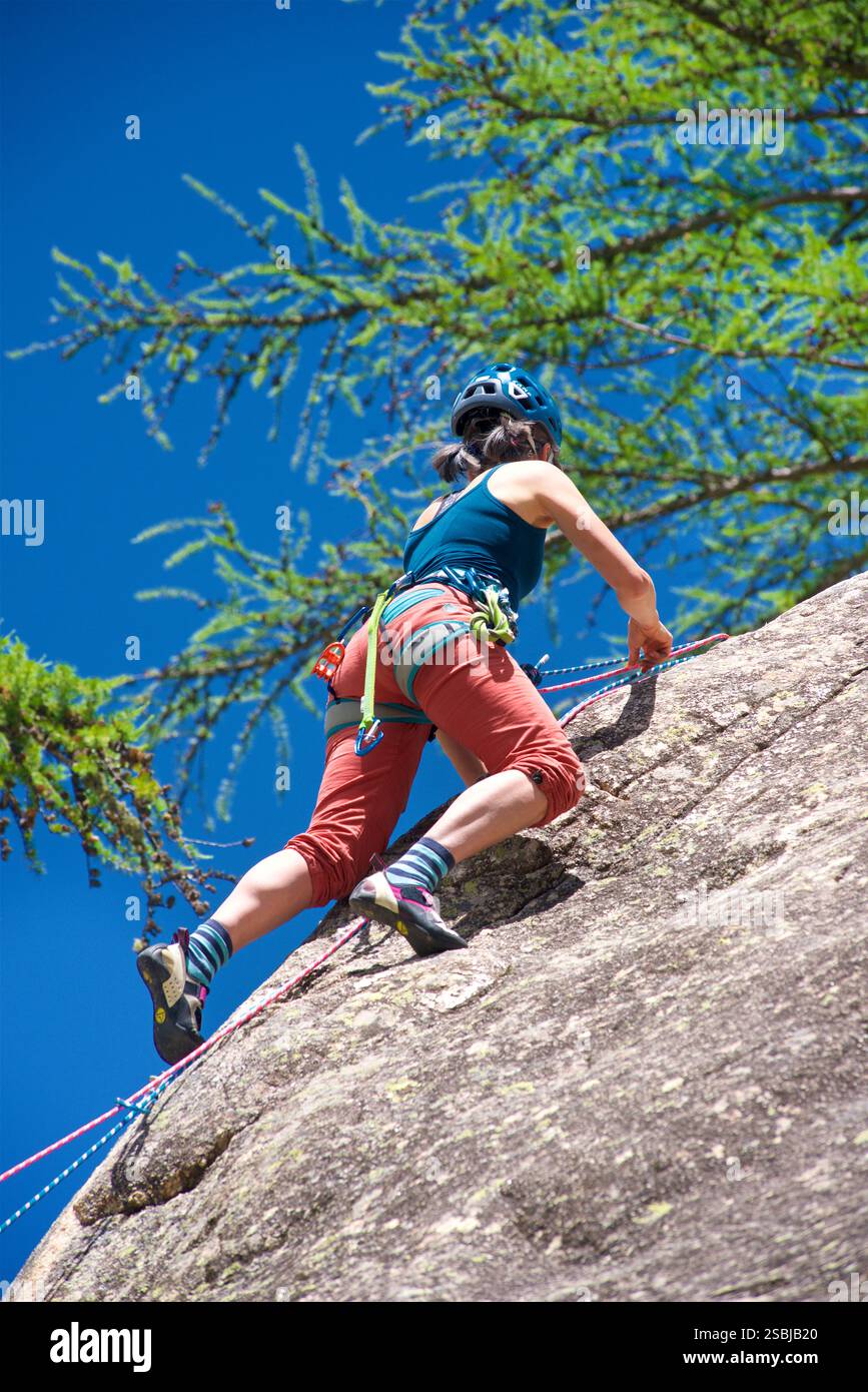 'Trad' rock climbing enthusiast scaling a rock face outside Ailefroide ...