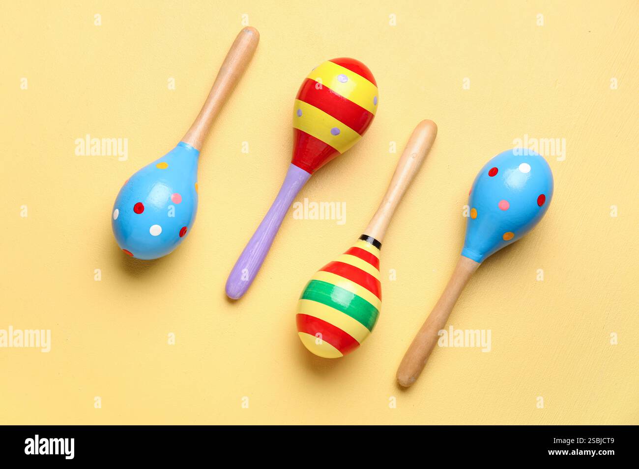 Mexican maracas on yellow background Stock Photo - Alamy