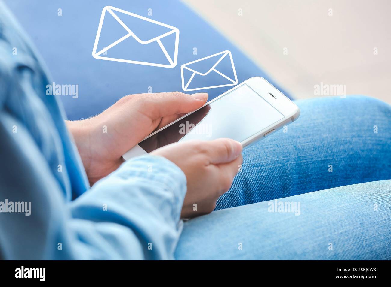 Woman with smartphone checking her e-mail at home Stock Photo - Alamy