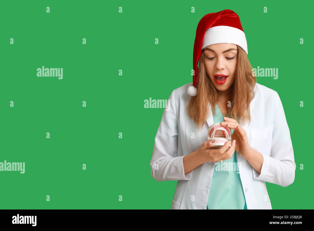 Female dentist in green uniform hi-res stock photography and images - Alamy