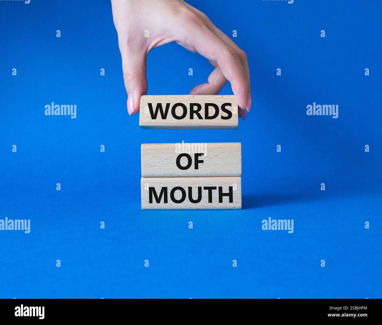 Words of mouth symbol. Concept word Words of mouth on wooden blocks ...