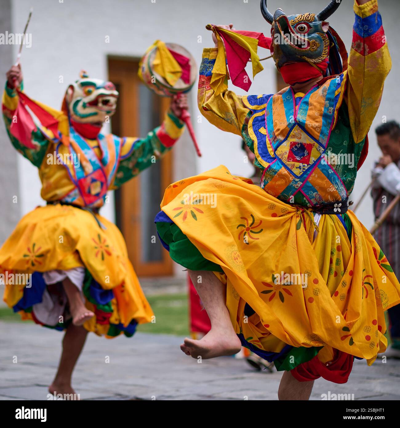 Traditional masked dancers performing in Bhutan festival celebration ...