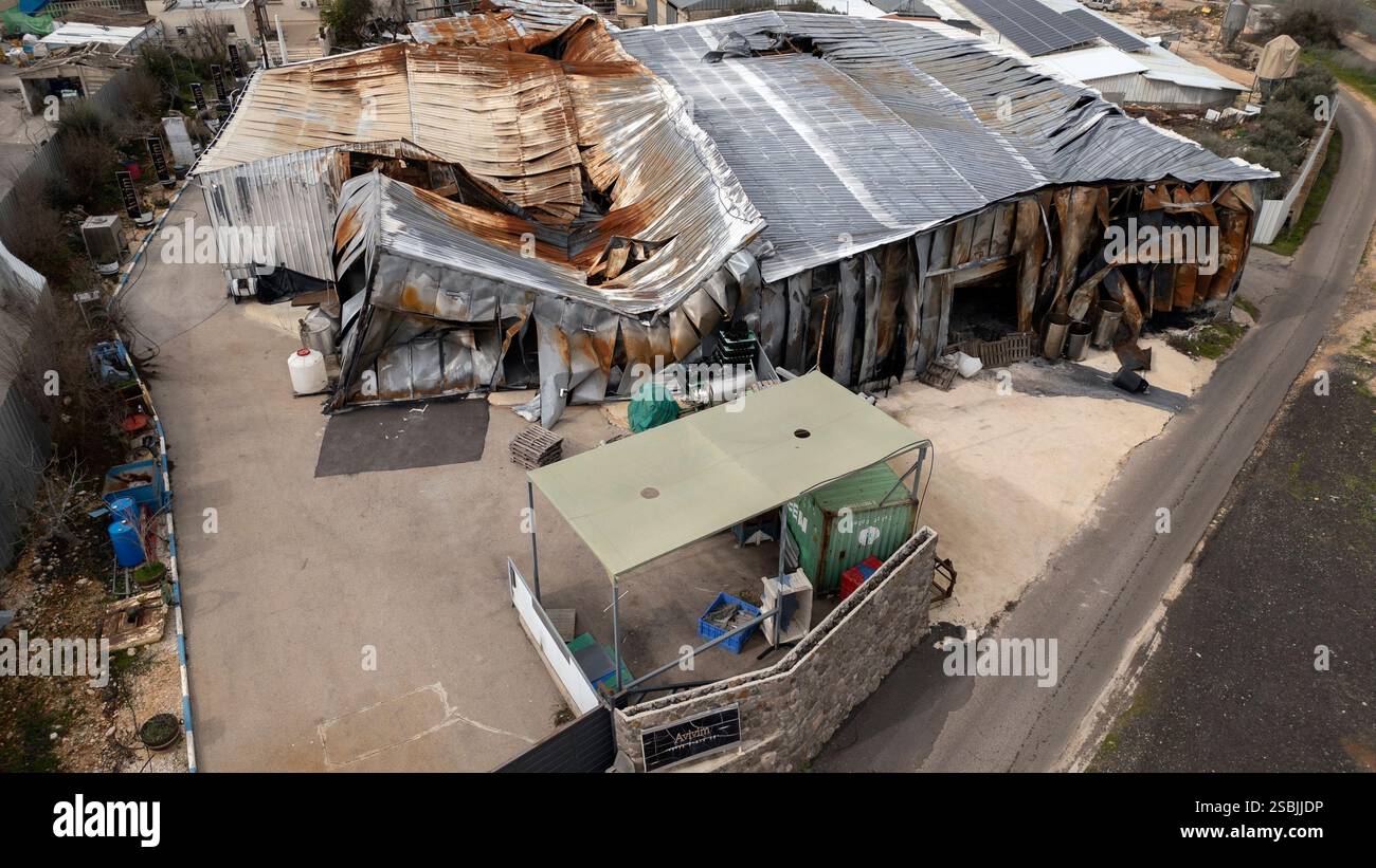 An aerial view from a drone shows the roofs and destruction in the ...