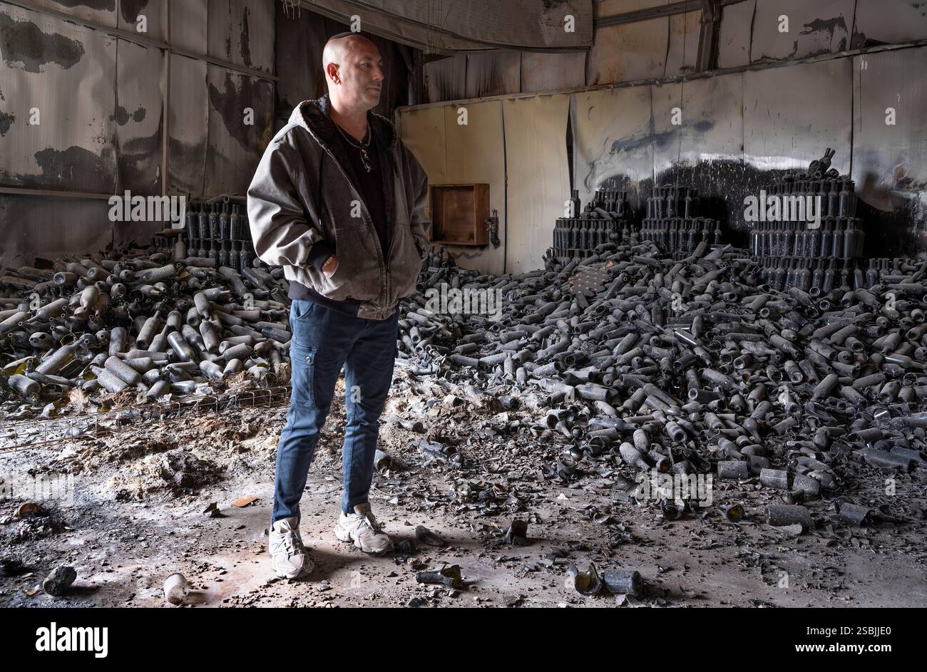 Meir Biton the manager of Avivim Winery looks over the destruction in ...