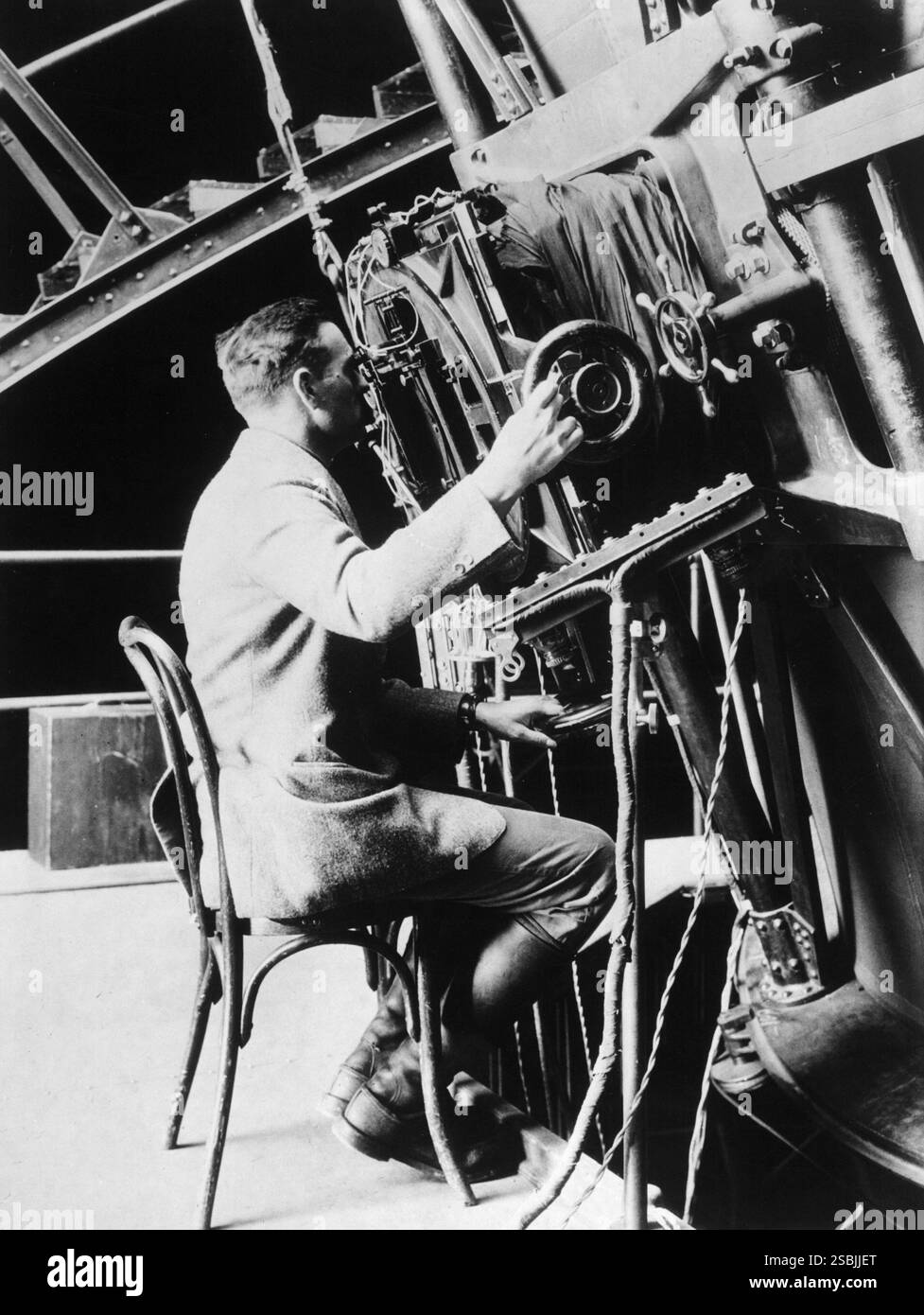 Edwin Hubble seated at the Newtonian focus of the 100-inch reflecting ...