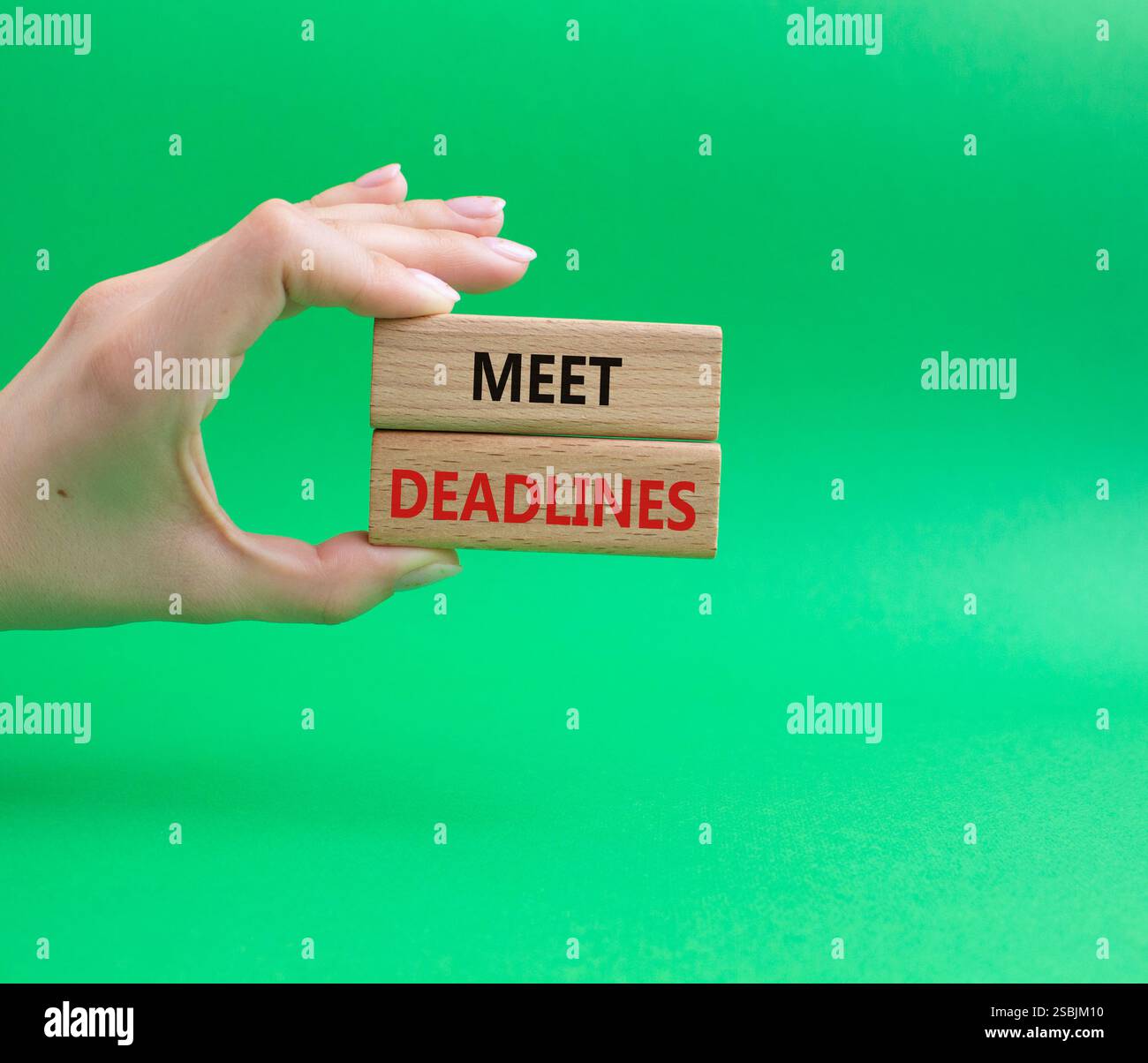 Meet Deadlines symbol. Concept word Meet Deadlines on wooden blocks ...