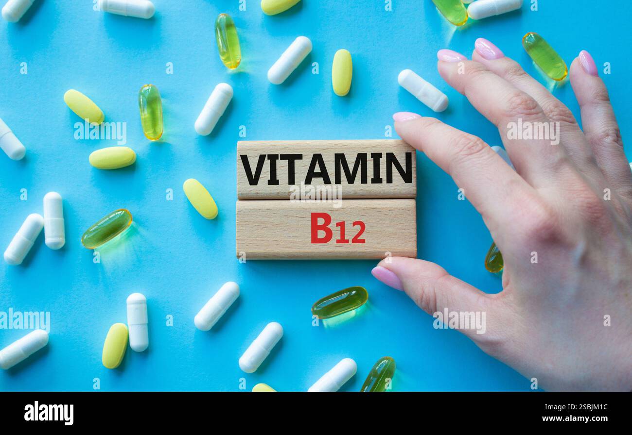 Vitamin B12 symbol. Concept word Vitamin B12 on wooden blocks ...