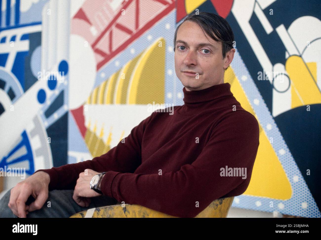 Roy Lichtenstein (1923-1997), American pop artist, with his art. Photographed by Bernard Gotfryd ...