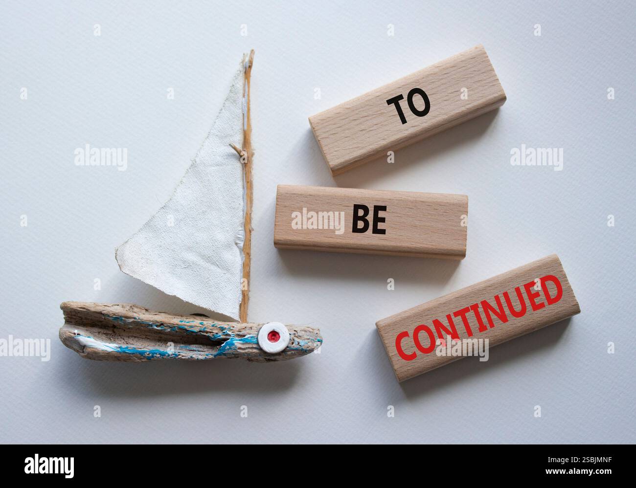 To be continued symbol. Concept words To be continued on wooden blocks ...