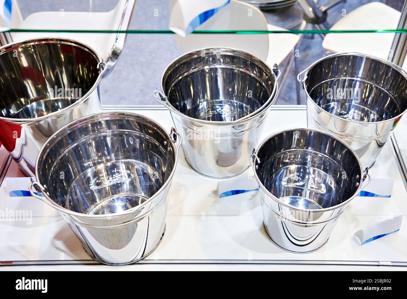 Stainless steel buckets for milking cows in the store Stock Photo - Alamy