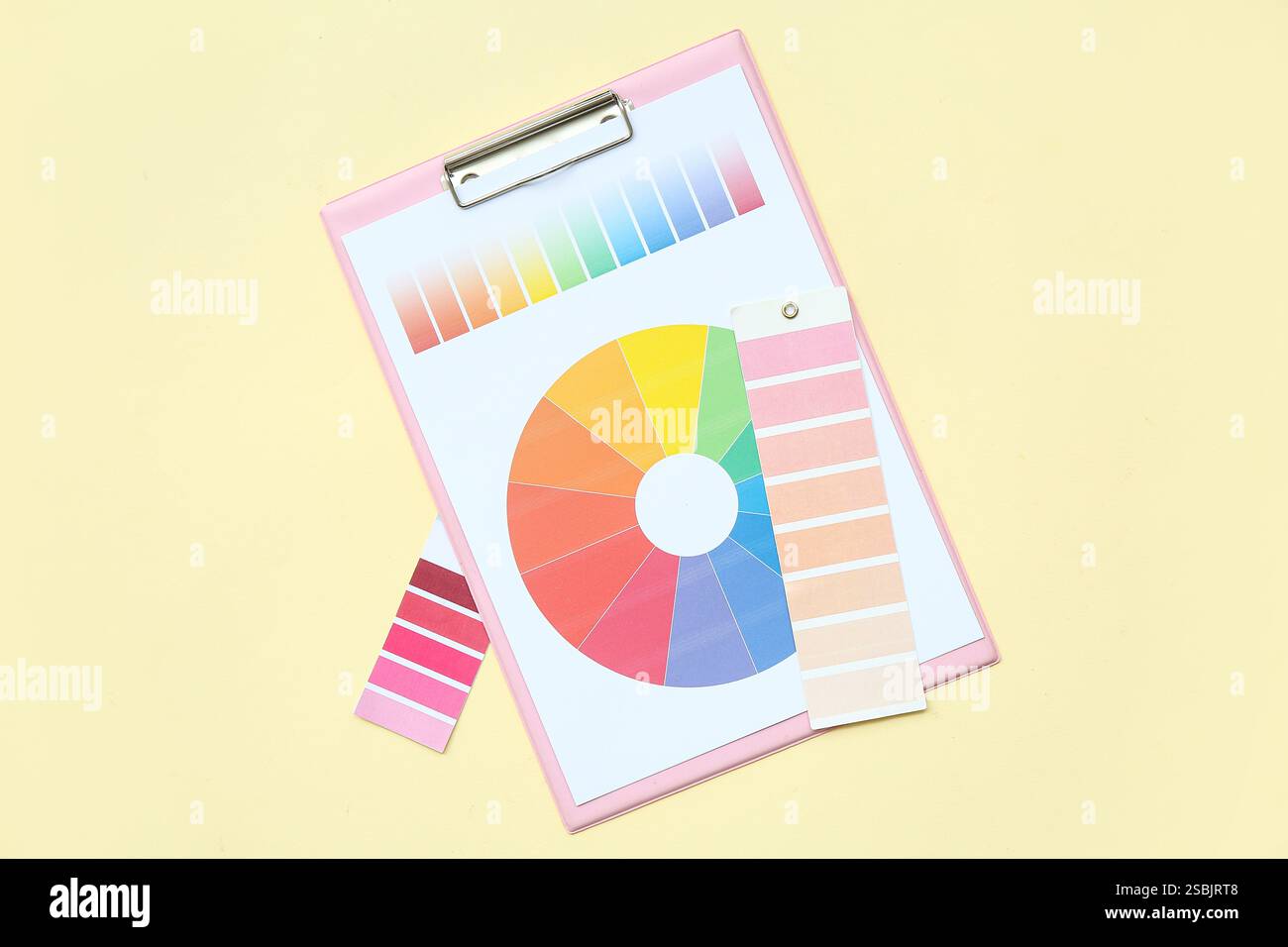 Clipboard with paint color palettes on yellow background Stock Photo ...