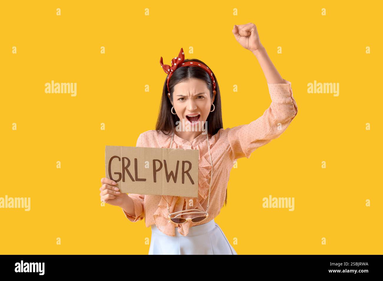 Young pin-up woman with GRL PWR sign on yellow background. Women's ...