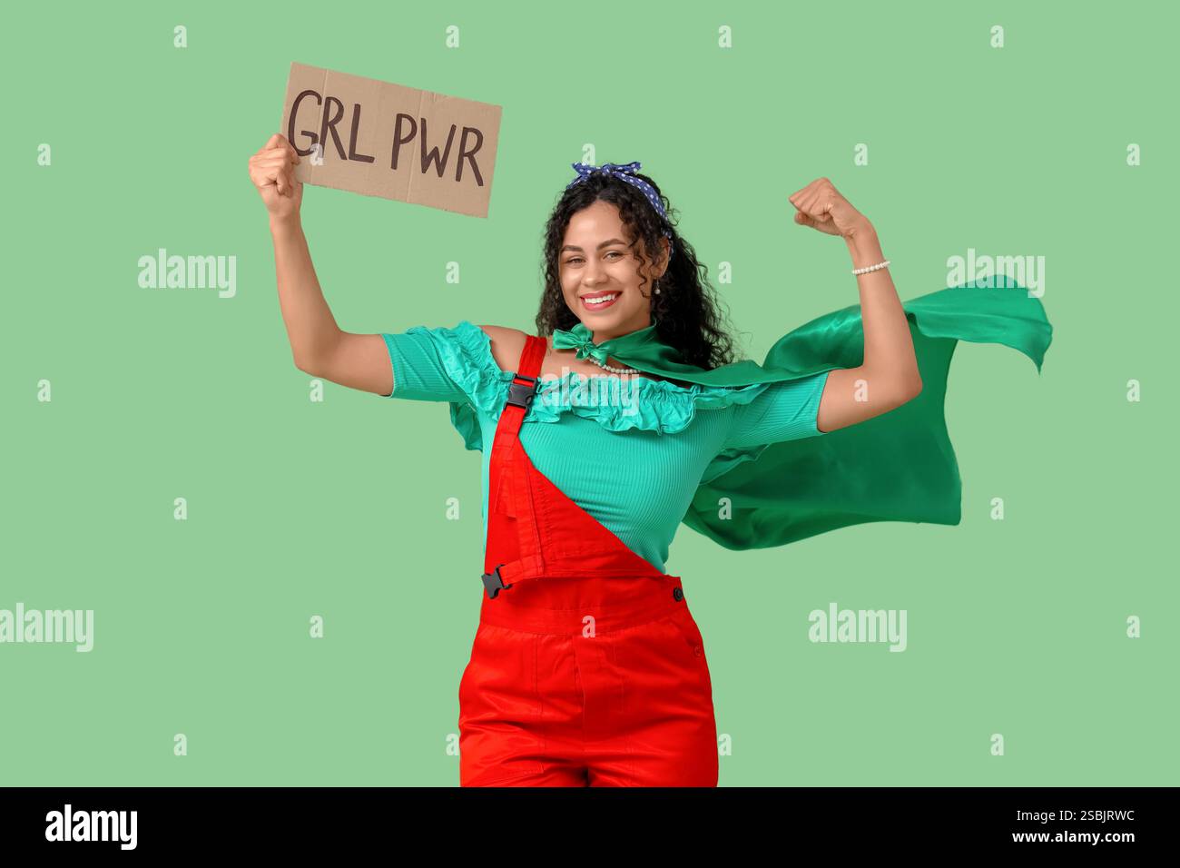 Young African-American pin-up woman with GRL PWR sign and super hero ...