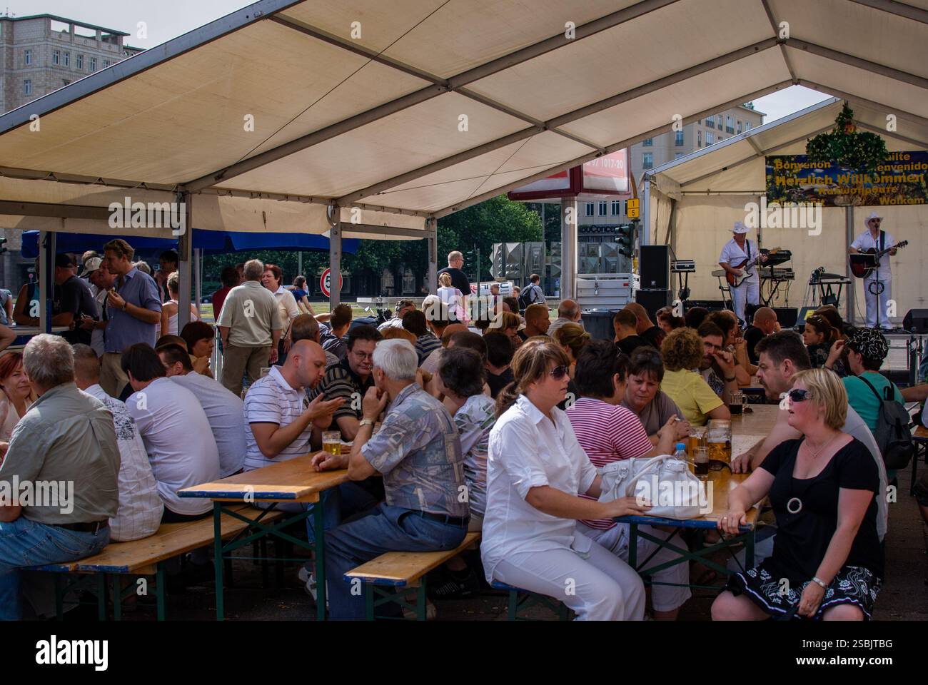 Outdoor Bier Festival with Live Music and Seated Crowd Stock Photo - Alamy