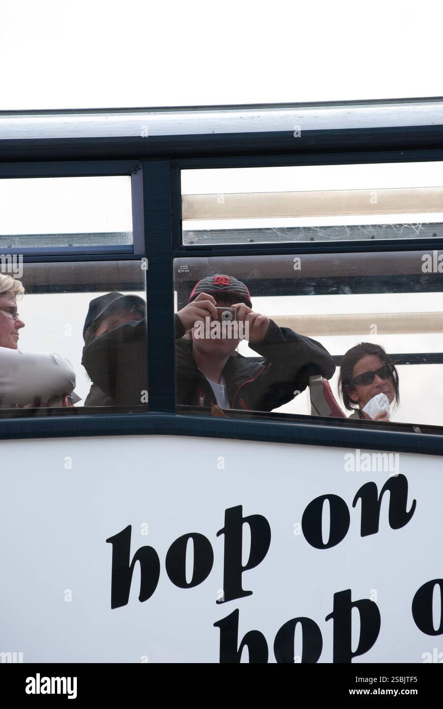 Tourists on a Hop On Hop Off Bus Taking Pictures Stock Photo - Alamy