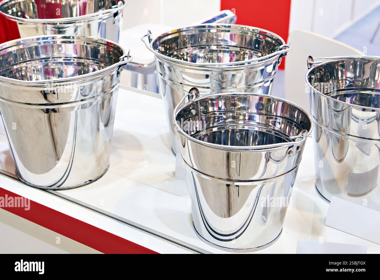 Stainless steel buckets for milking cows in the store Stock Photo - Alamy