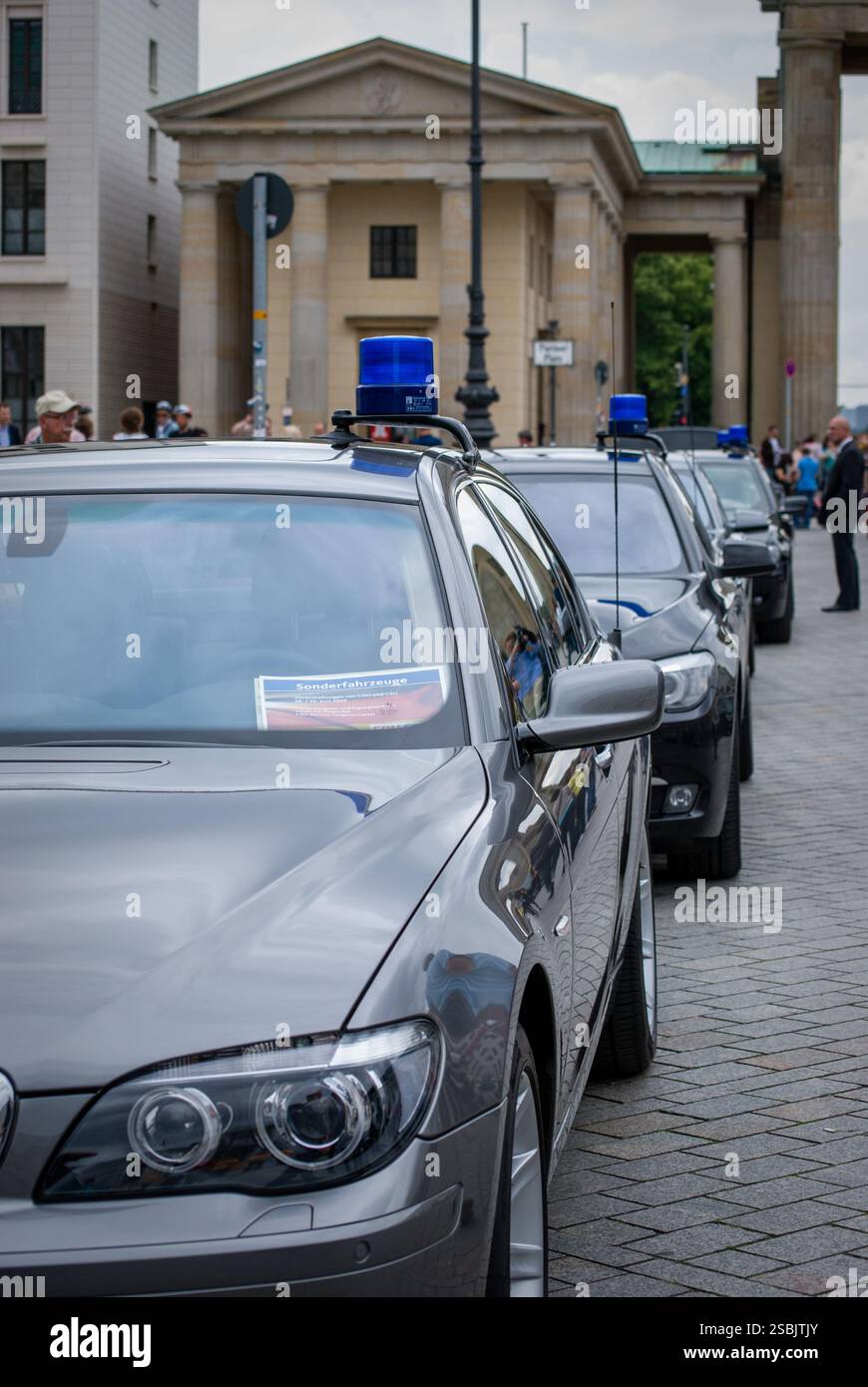 Line of Police Cars with Blue Lights and Urban Background Stock Photo ...