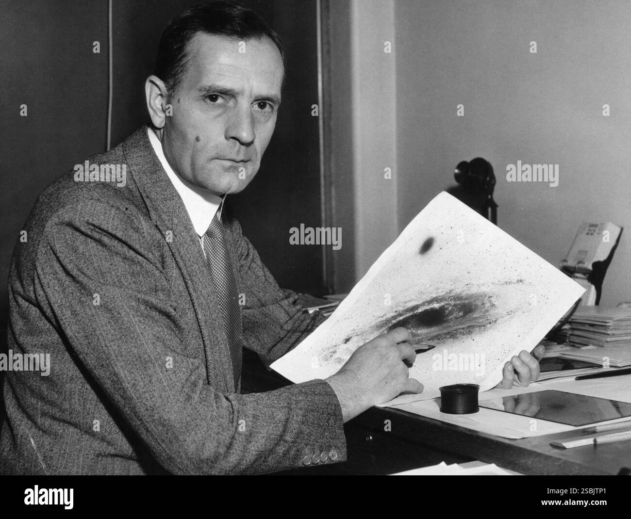 Edwin Hubble with an image of a galaxy, circa 1940. Hubble (1889-1953 ...