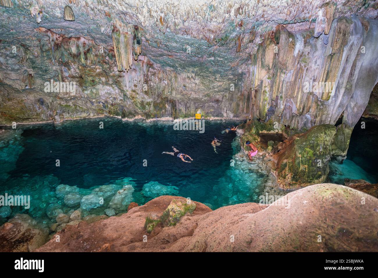 Swimming and snorkelling in the deep natural pool inside Saturno Cave ...