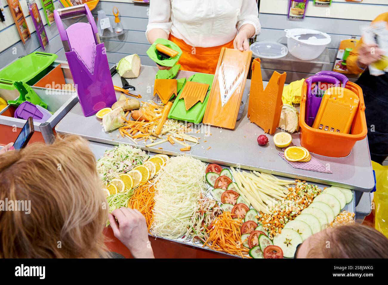 Demonstration of cutting vegetables and fruits with manual grater and ...