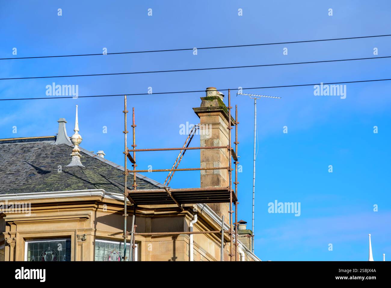 Scaffolding in place for a chimney repair on a house, UK, Europe Stock ...