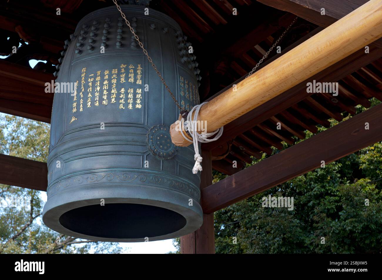 Large Japanese bronze bell with gold script on side and horizontal ...