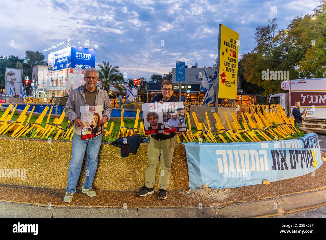 Haifa, Israel - February 03, 2025: Scene of people with signs and flags ...