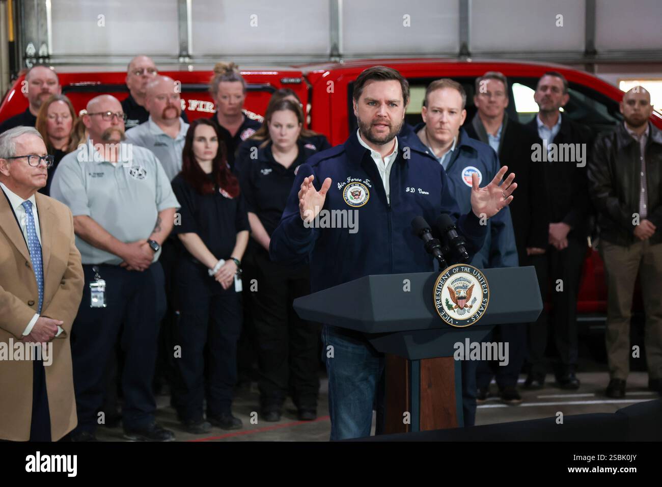 Ohio Gov. Mike DeWine, left, looks on as Vice President JD Vance speaks ...