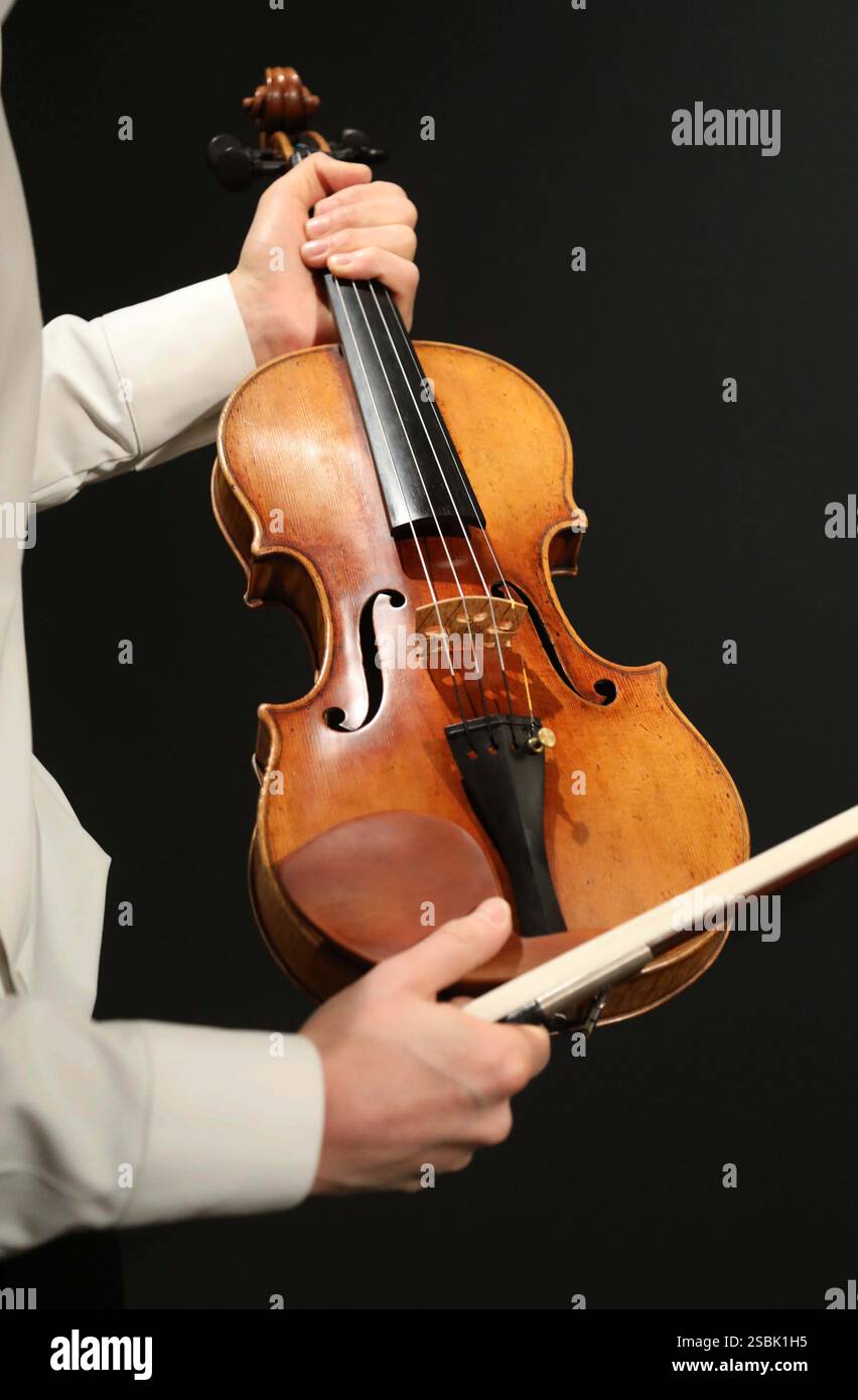 New York, New York, USA. 3rd Feb, 2025. Violinist STEFAN JACKIW holds ...