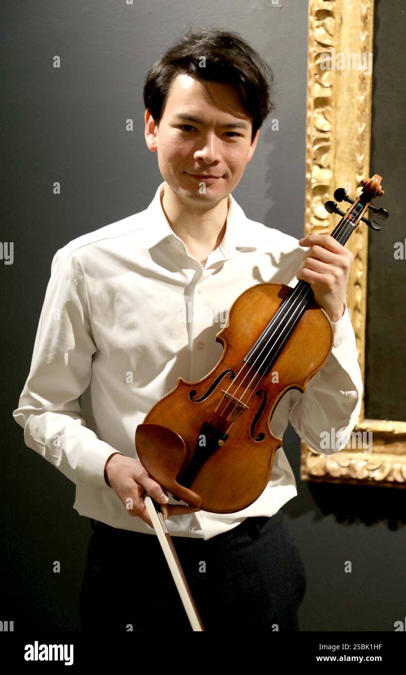 New York, New York, USA. 3rd Feb, 2025. Violinist STEFAN JACKIW holds ...