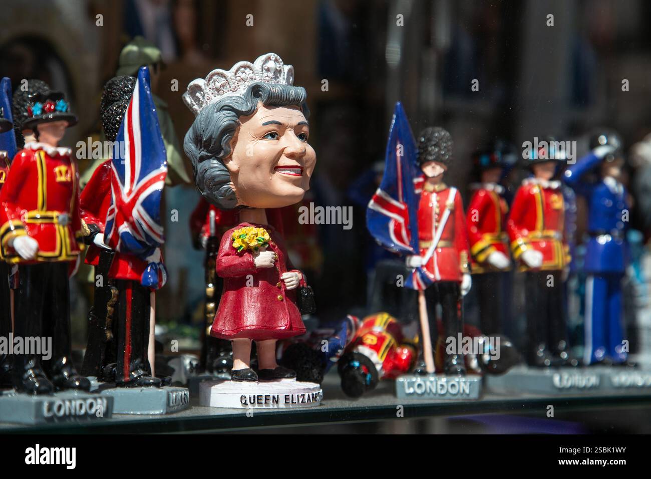 Bobbing head Queen Elizabeth II figurine at a souvenir shop, London ...
