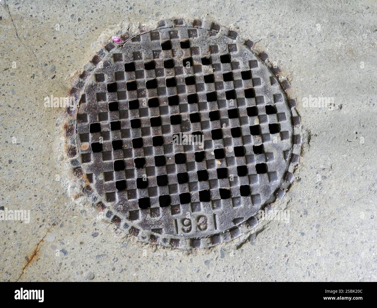Iron manhole/sewer covers in London Ontario Stock Photo - Alamy