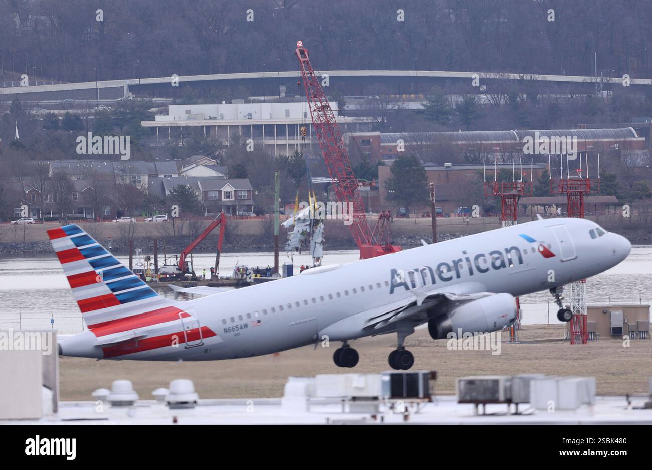 Washington Dc, Virginia, USA. 3rd Feb, 2025. A plane take off as crews ...