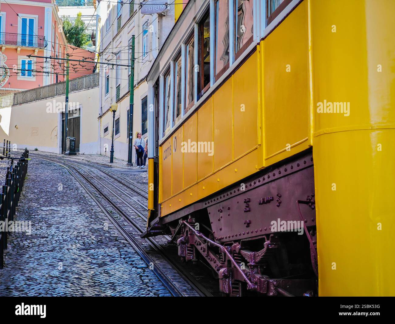 Gloria Funicular in Lisbon. Tram with a wood brass interior climbing a ...
