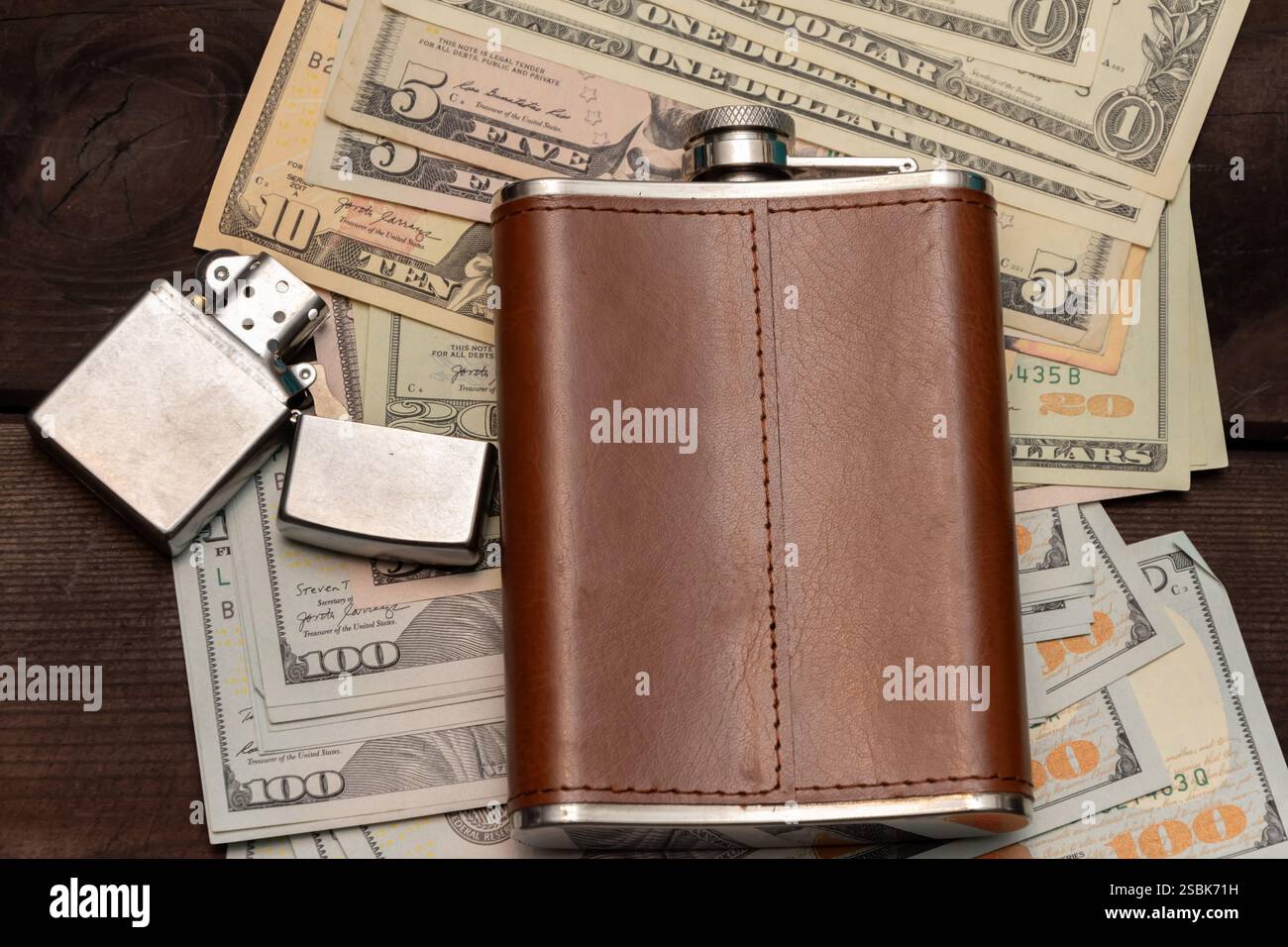 Money, lighter, alcohol - a visual image of destructive habits Stock ...